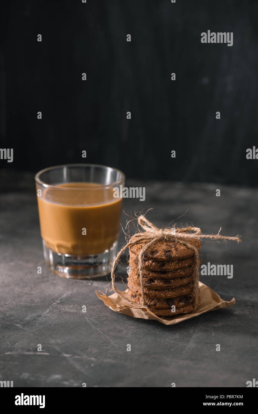 Tasty cookies and glass of coffee with milk on a plain background Stock ...