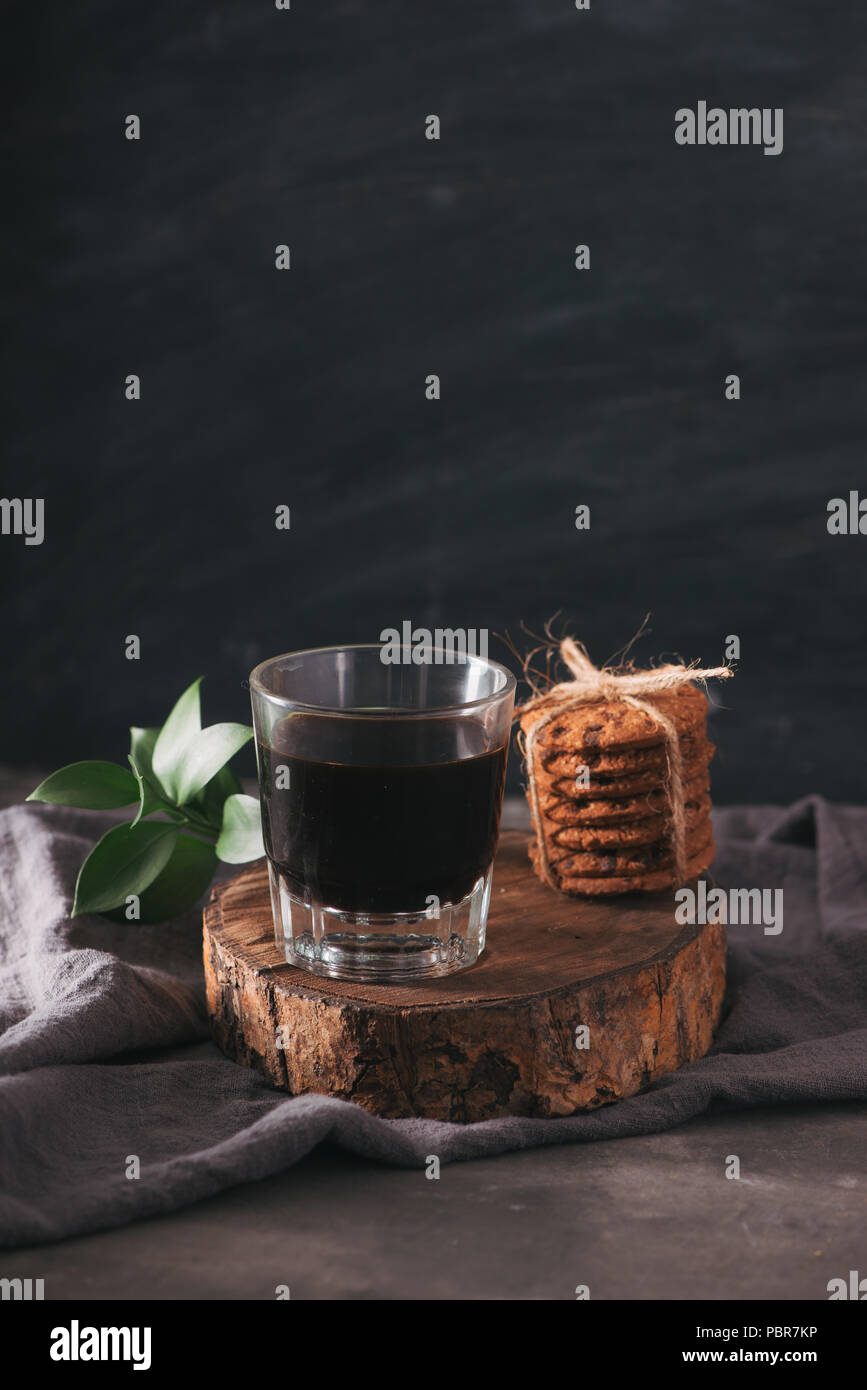 Glass cup of coffee and Chocolate chip cookies on the table Stock Photo ...