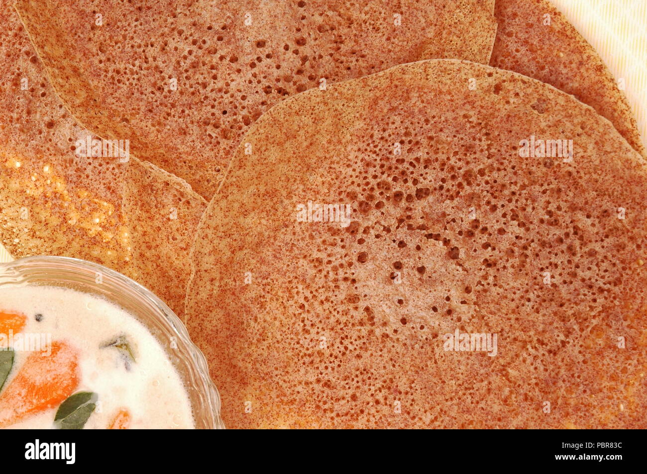 ragi(finger millet)appam ,a popular kerala breakfast dish,with potato ...