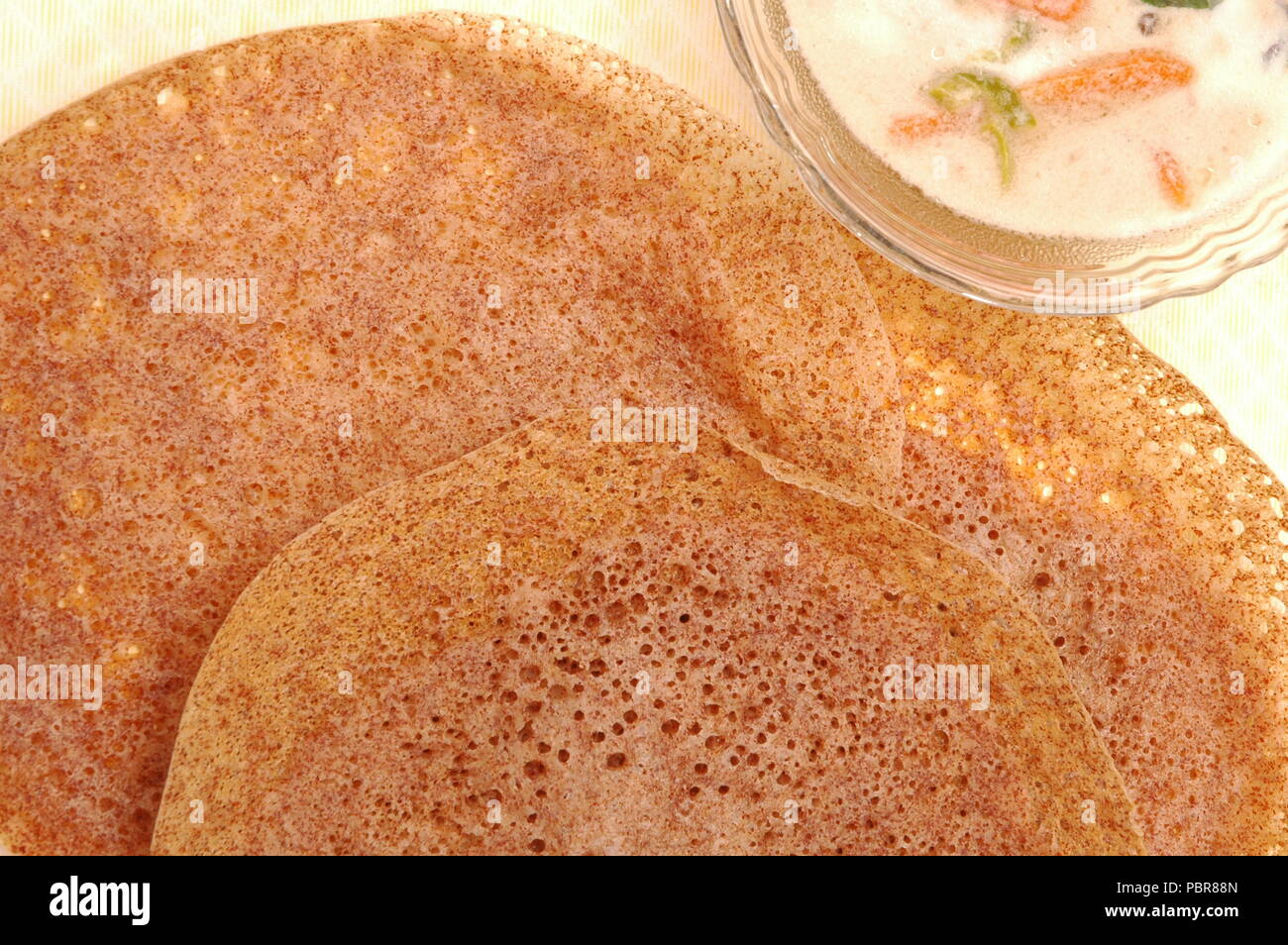 ragi(finger millet)appam ,a popular kerala breakfast dish,with potato ...