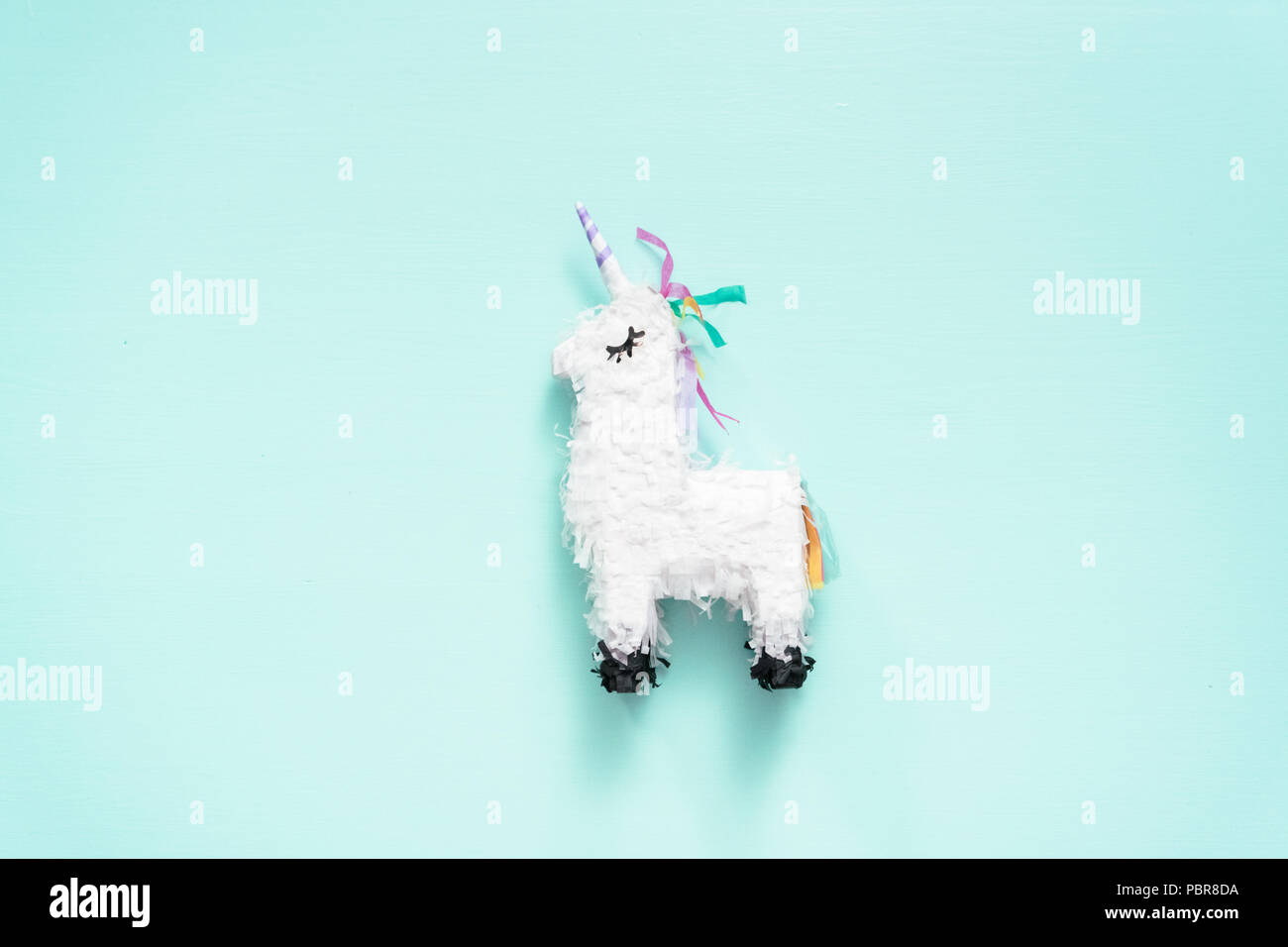 Small unicorn pinata for kids birthday party Stock Photo - Alamy