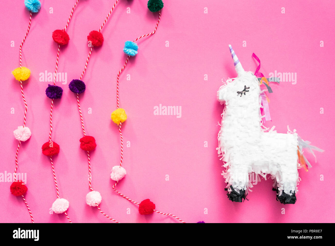 Small unicorn pinata for kids birthday party Stock Photo - Alamy