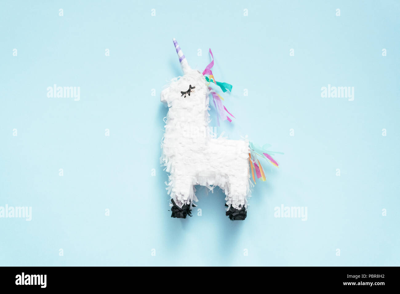 Small unicorn pinata for kids birthday party Stock Photo - Alamy