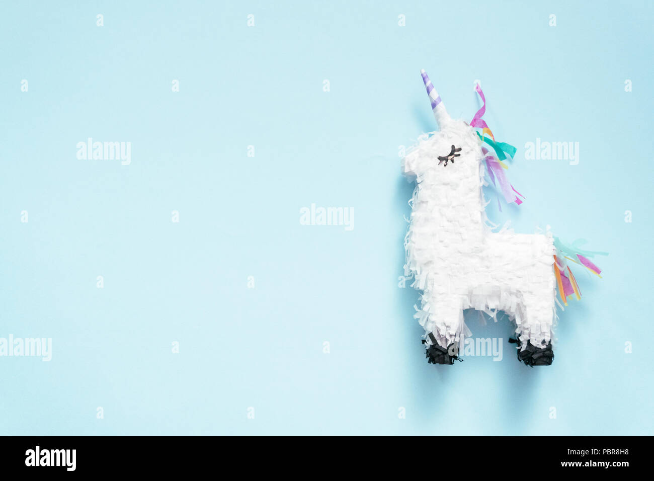 Small unicorn pinata for kids birthday party Stock Photo - Alamy