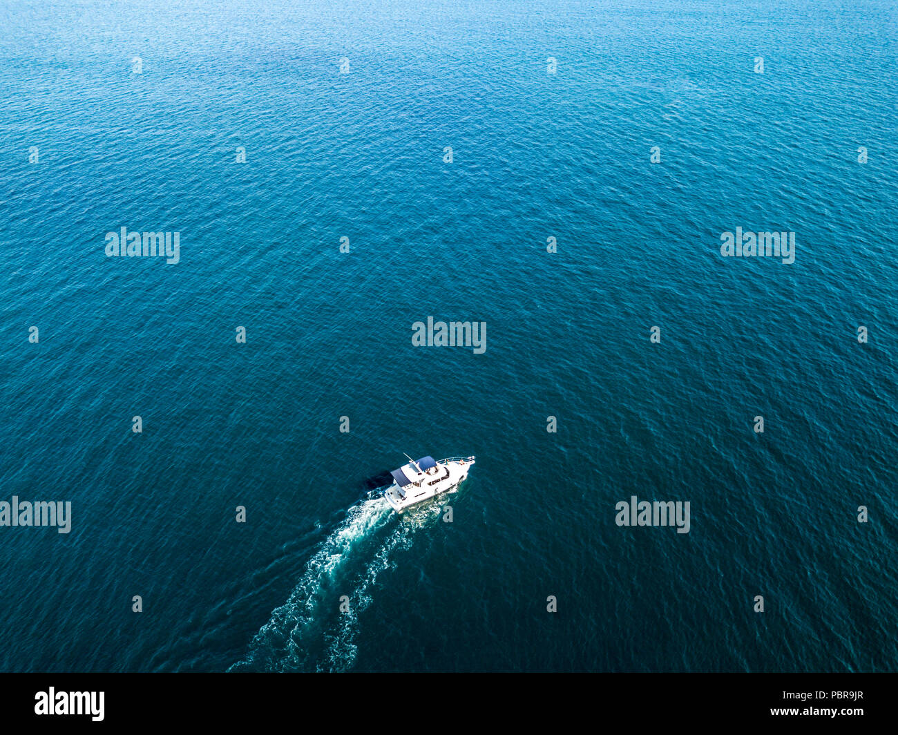 aerial personal luxury expensive fast speed boat ship on the sea water ...