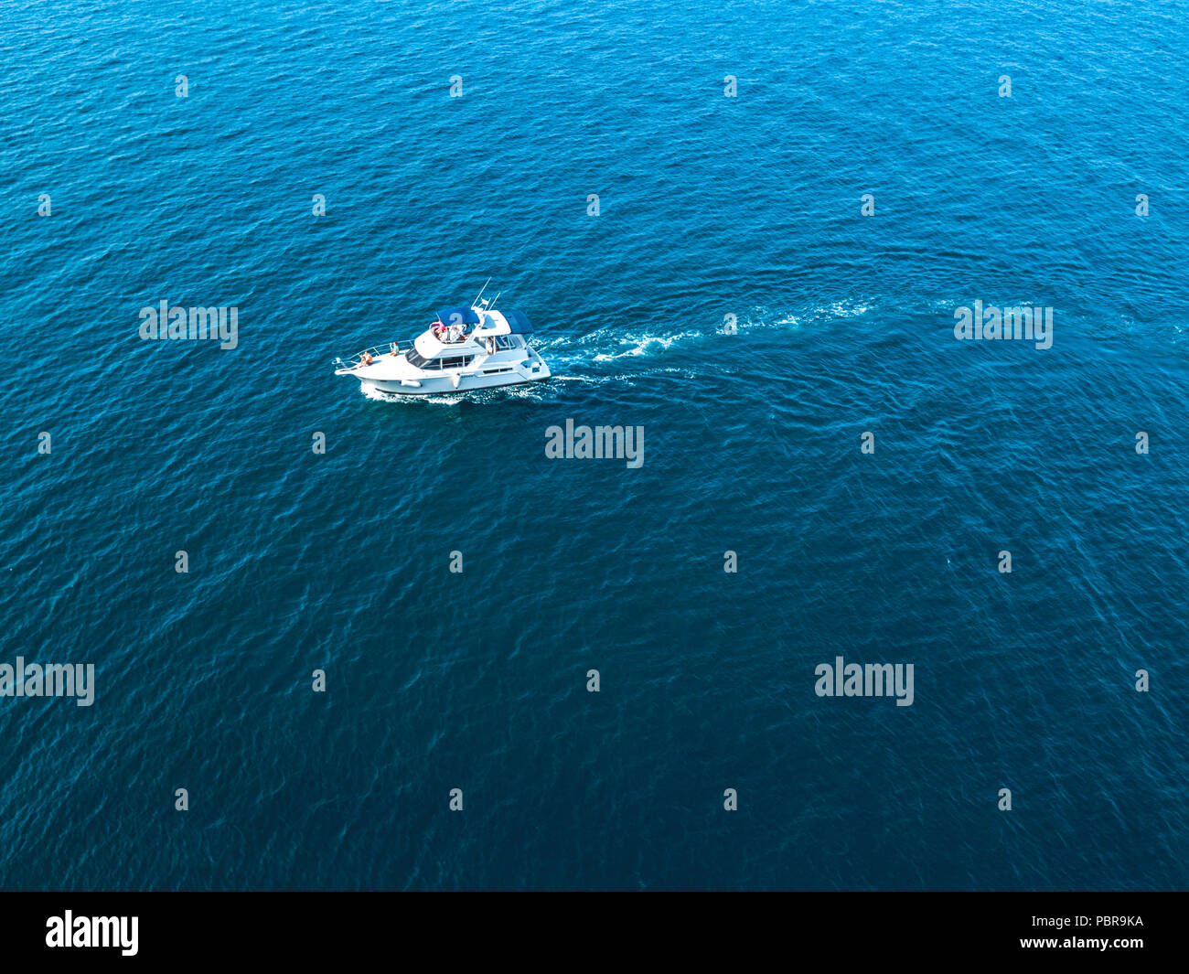 aerial personal luxury expensive fast speed boat ship on the sea water ...
