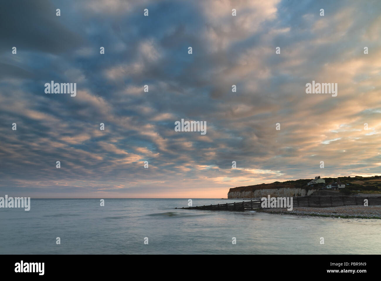 Beautiful dramatic Summer sunset over Seven Sisters landscape in Englad ...