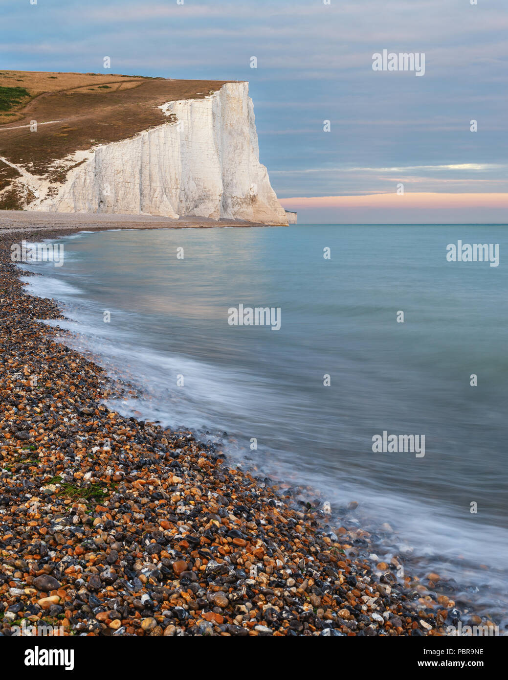 Beautiful dramatic Summer sunset over Seven Sisters landscape in Englad ...