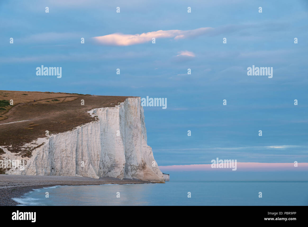 Beautiful dramatic Summer sunset over Seven Sisters landscape in Englad ...