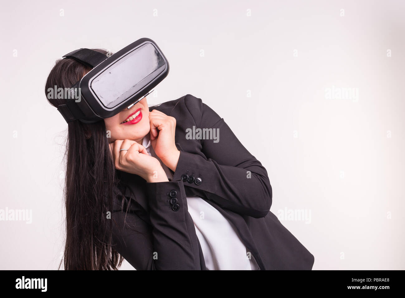 Woman with virtual reality goggles. Studio shot, white background Stock ...