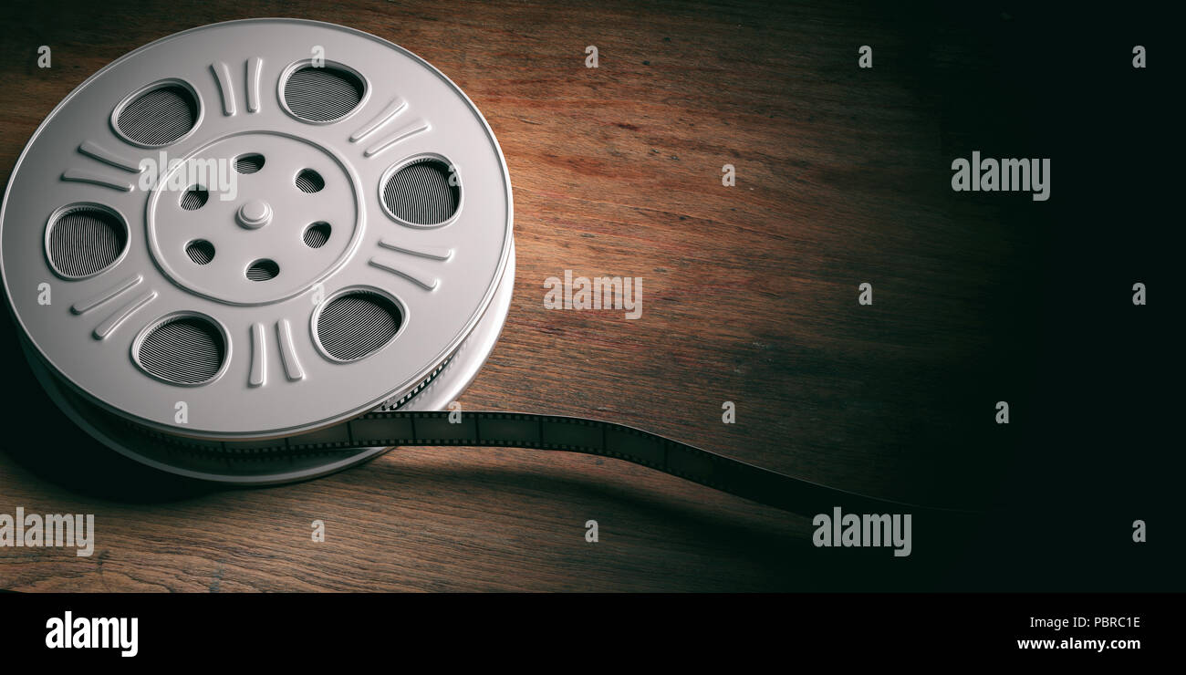 Cinematography concept. Film movie reel, isolated on a wooden ...