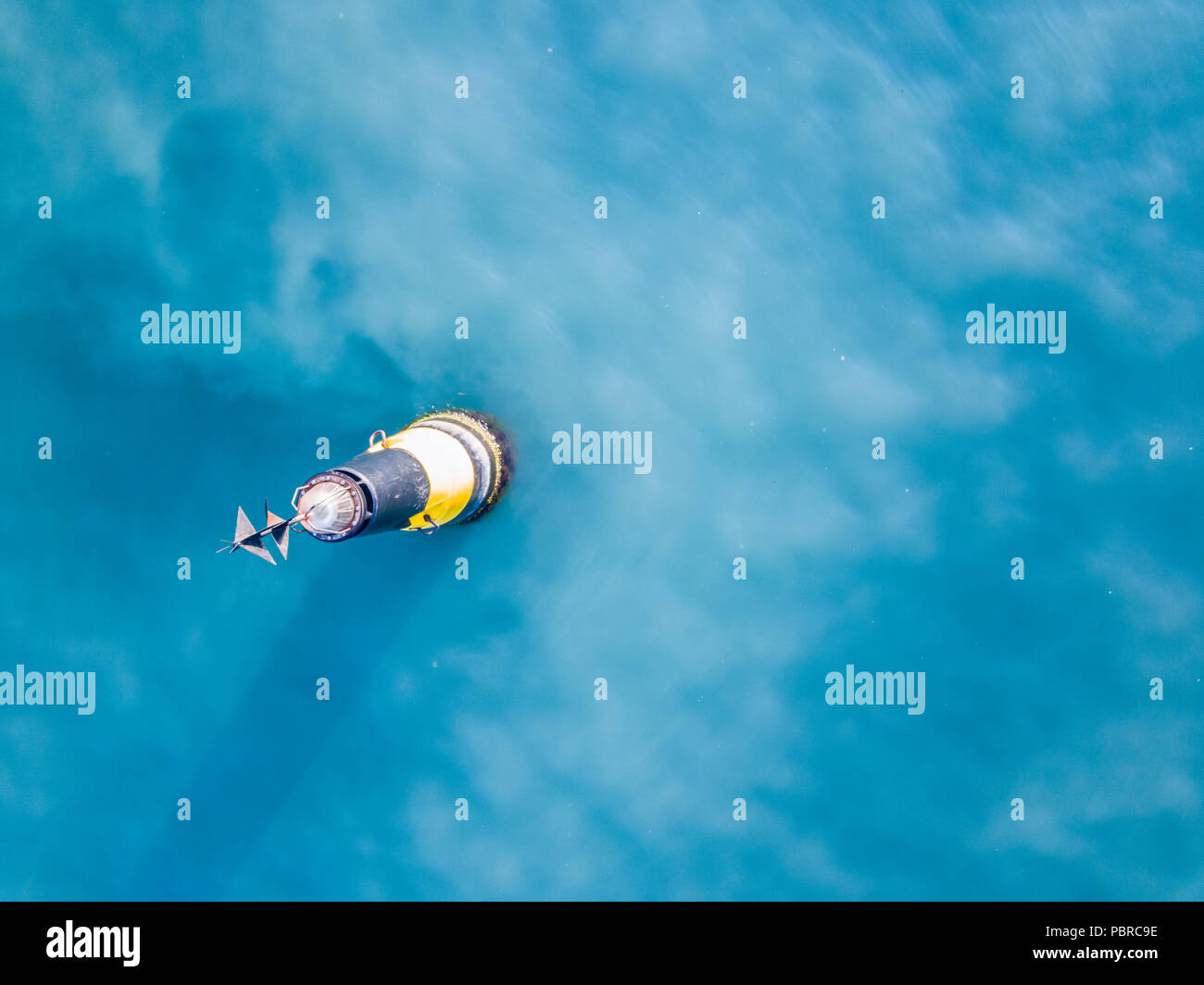 aerial top view from above sea buoy isolated in a water wave surface ...