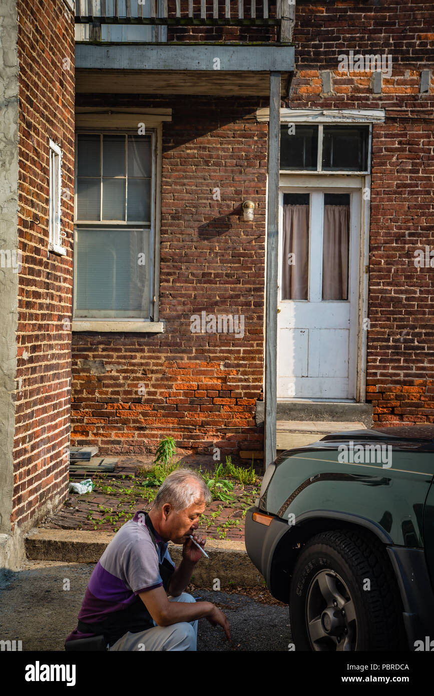 Back alley brick wall shadow patterns Stock Photo - Alamy