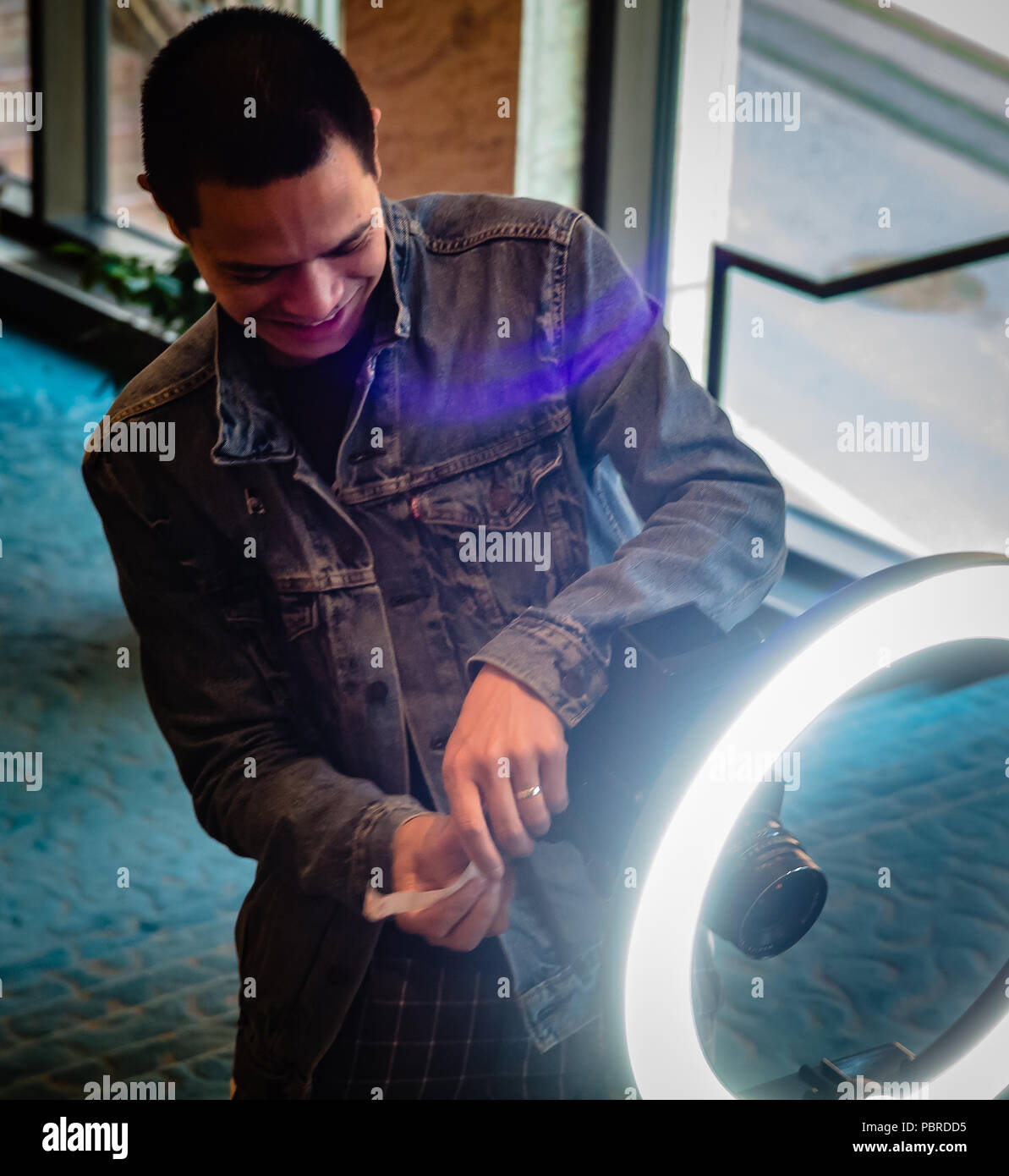 Photographer doing event portraits at art gallery opening Stock Photo ...