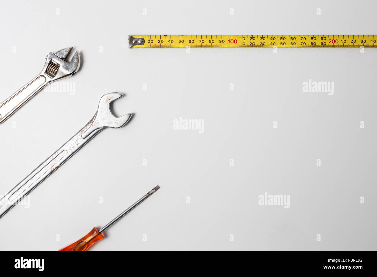 Tools on white background with copy space Stock Photo - Alamy