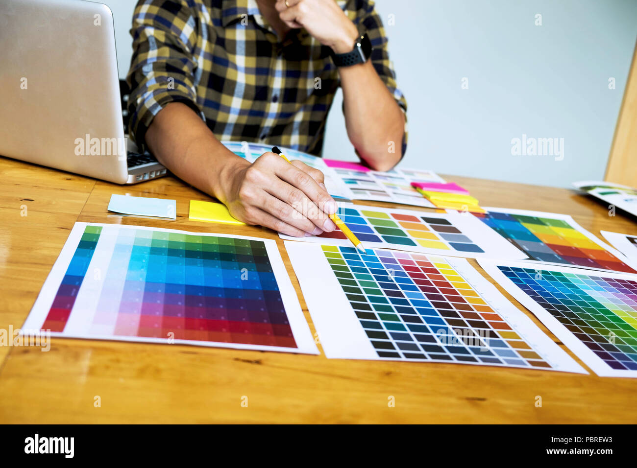 Graphic designers choose colors from the color bands samples for design ...