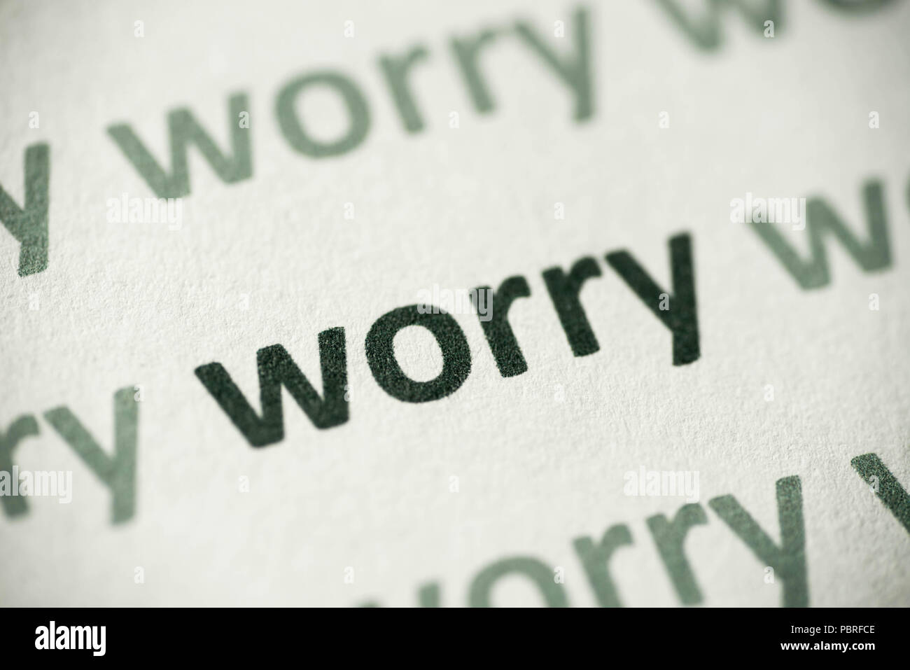 word worry printed on white paper macro Stock Photo - Alamy