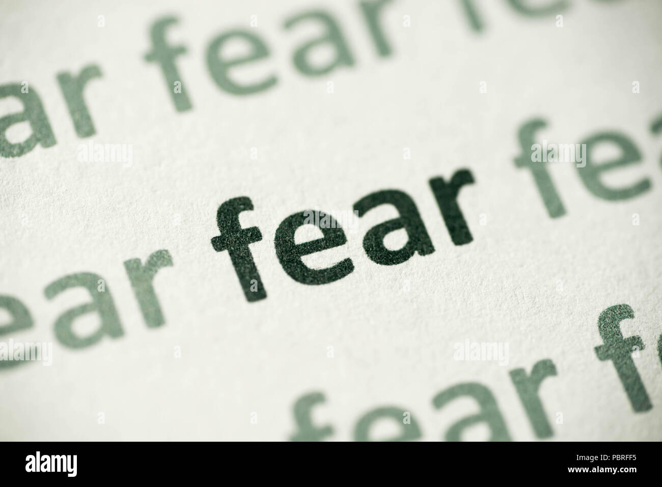 word fear printed on white paper macro Stock Photo - Alamy