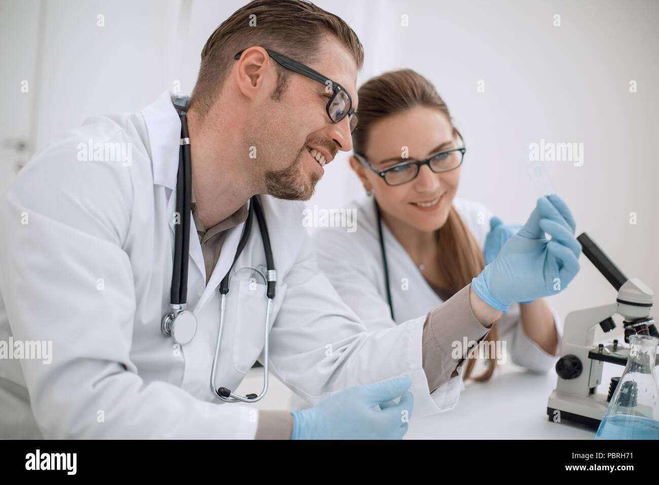two scientists are conducting tests in the laboratory Stock Photo - Alamy