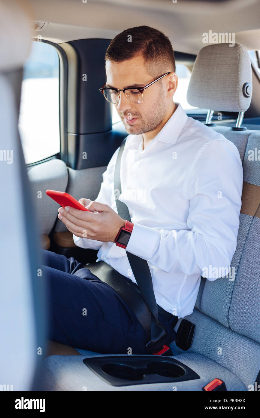 Smart handsome businessman checking messages Stock Photo - Alamy Smart handsome businessman checking messages Stock Photo - Alamy