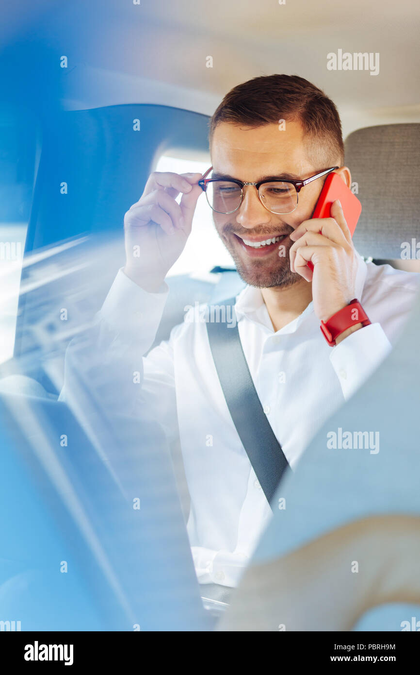 Positive cheerful businessman having a phone conversation Stock Photo ...