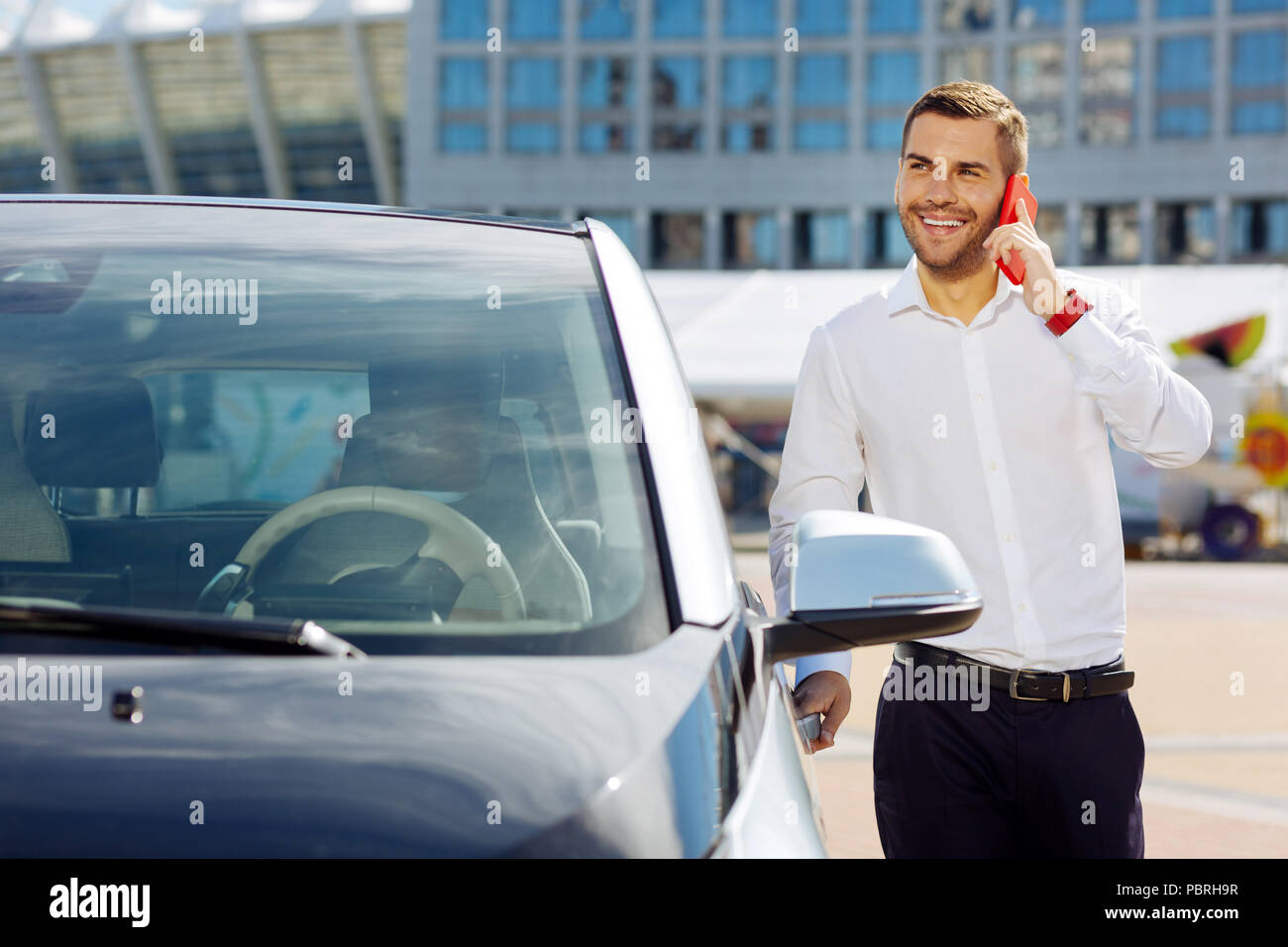 Joyful positive man holding his car door Stock Photo - Alamy Joyful positive man holding his car door Stock Photo - Alamy