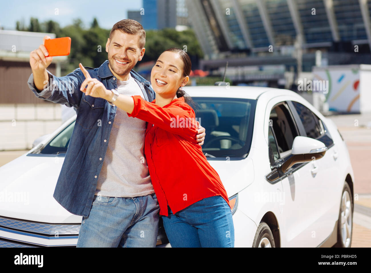 Happy nice woman pointing hi-res stock photography and images - Alamy