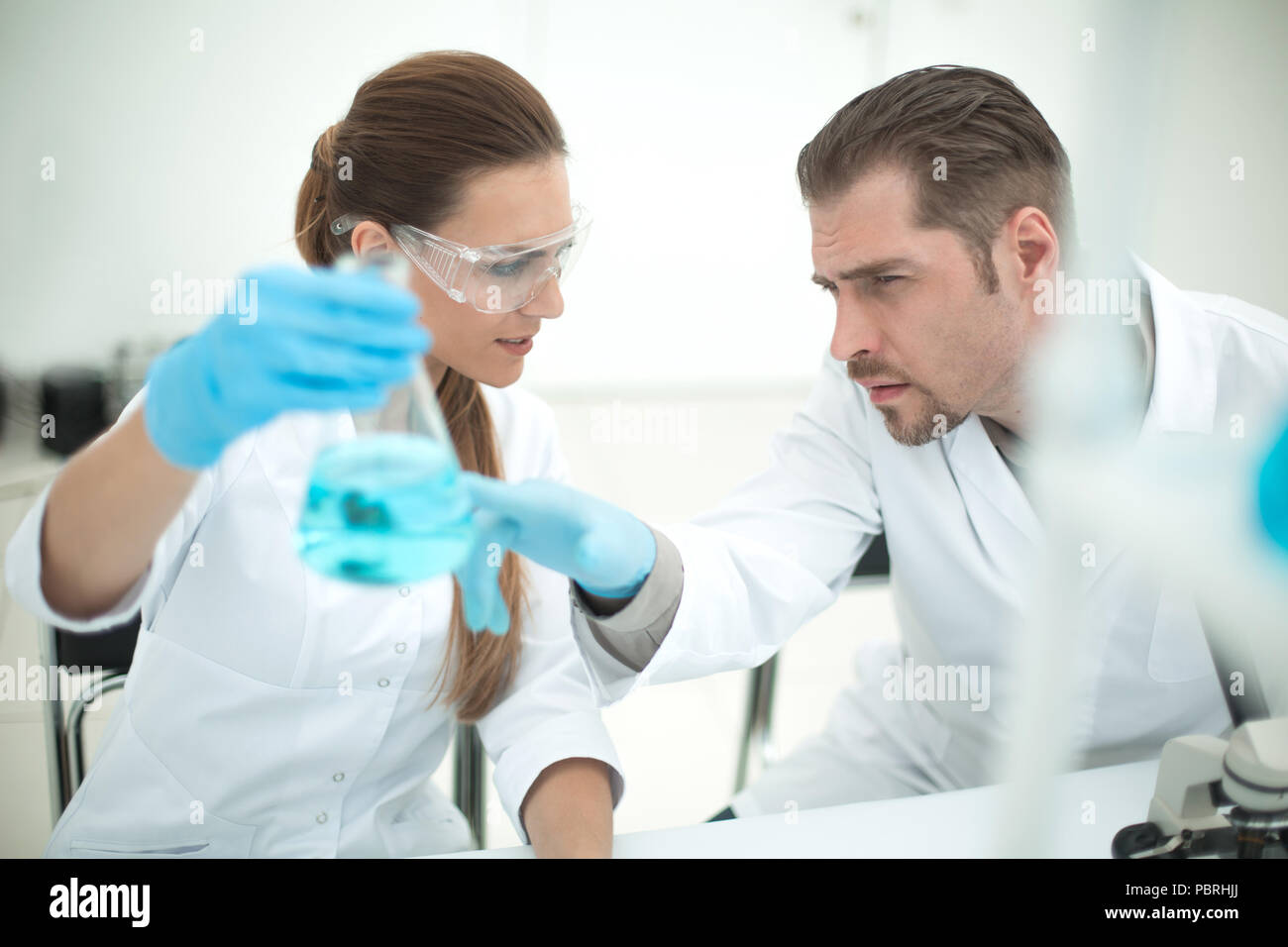 Two scientists are working in laboratory Stock Photo - Alamy