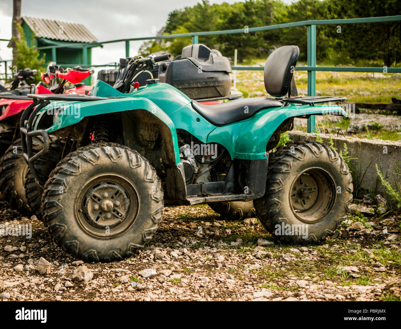 parked atv off road motor vehicle outdoor rainy day Stock Photo - Alamy