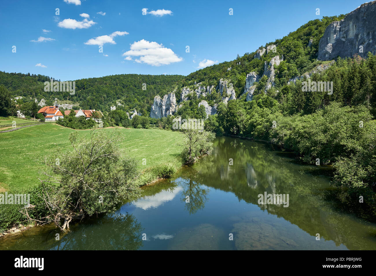 Jurassic limestone rocks are reflected in the Danube, left the manor ...