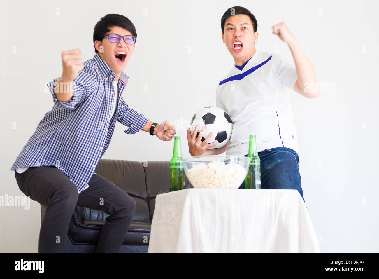 friendship, sports and entertainment concept - happy male friends ...