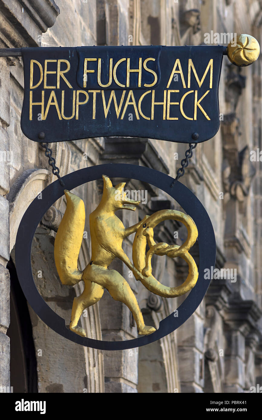 Hanging shop sign with fox figur and pretzel at a bakery, Bamberg ...