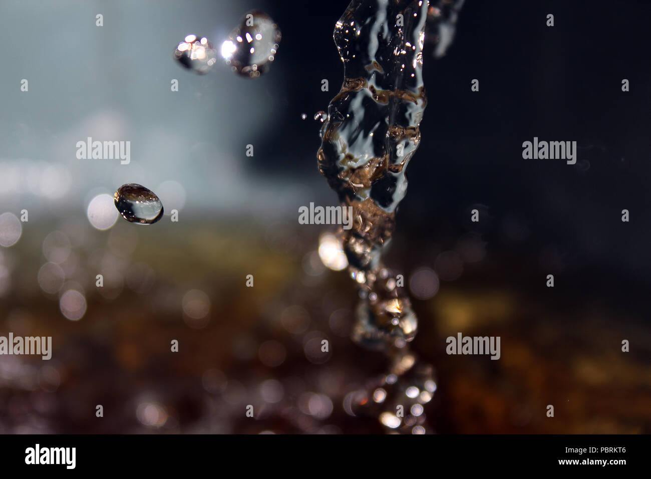 Droplets hitting water surface Stock Photo - Alamy