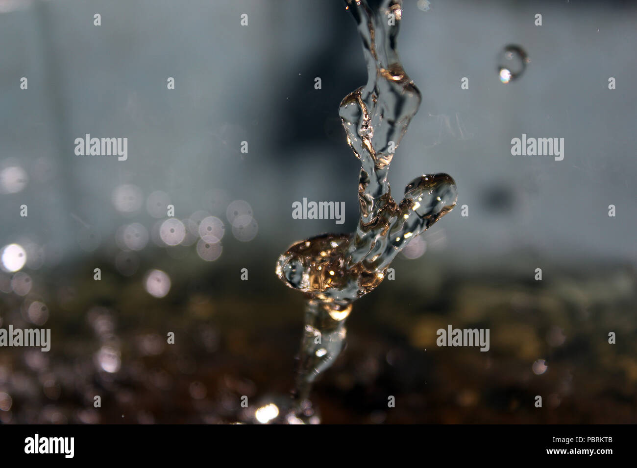 Droplets hitting water surface Stock Photo - Alamy