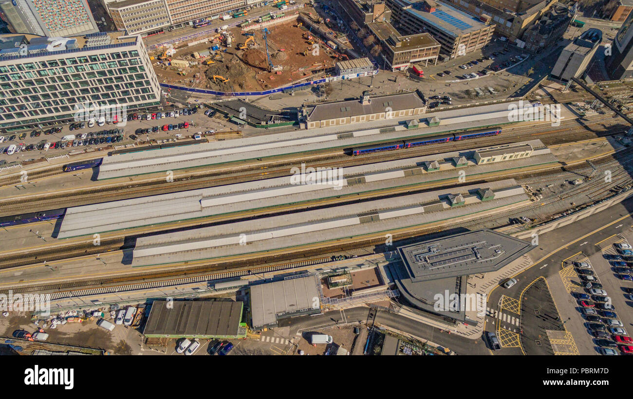 Aerial views over Cardiff Central Station, Central Square and the city ...
