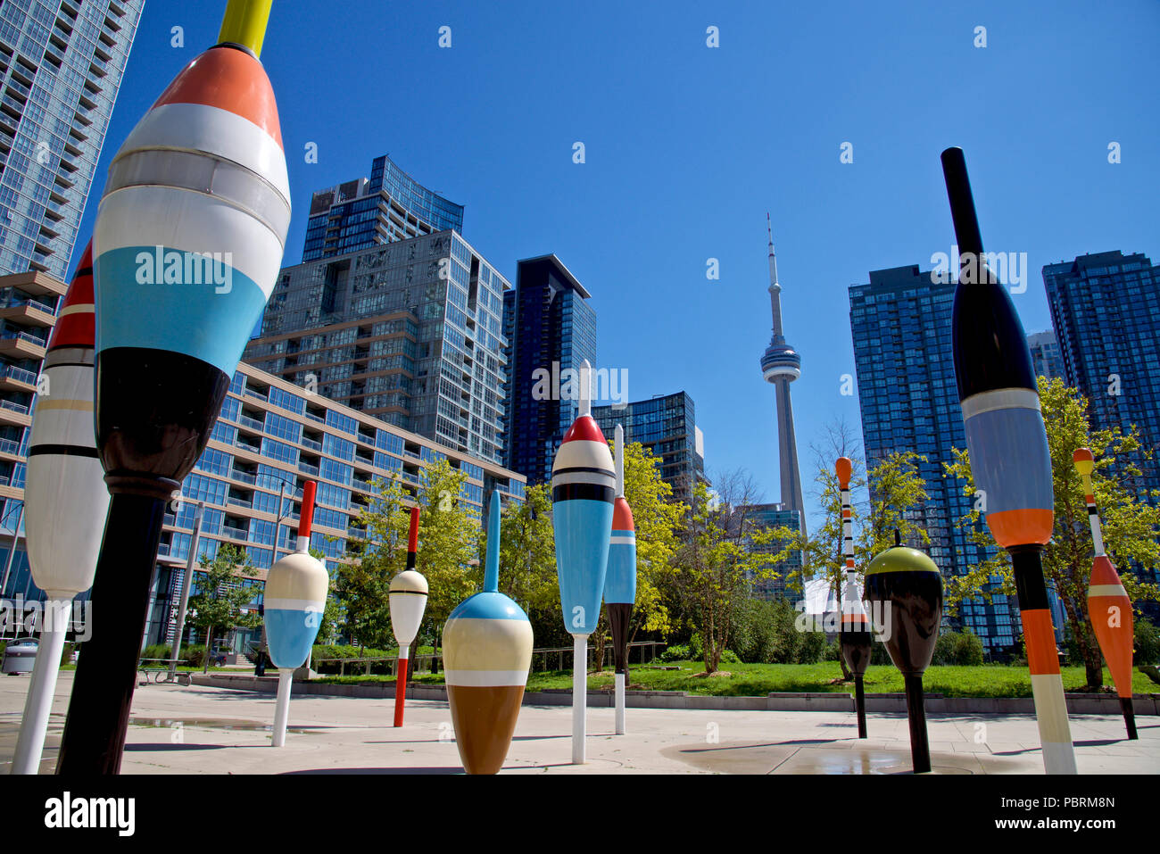 urban architecture buildings and sculptures in a public park with city ...