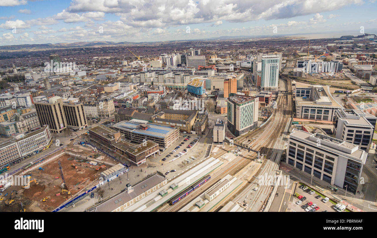 Aerial views over Cardiff Central Station, Central Square and the city ...