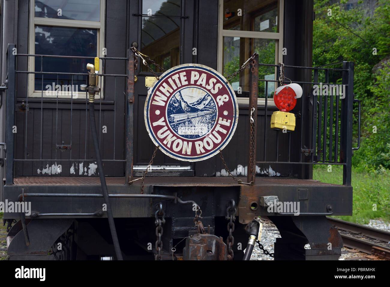 a vintage carriage showing the sign for the White Pass & Yukon route ...