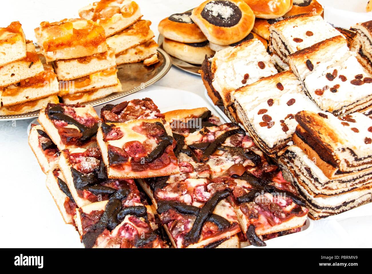 Fresh pastries for sale in a bakery. Sales of different types of cakes ...