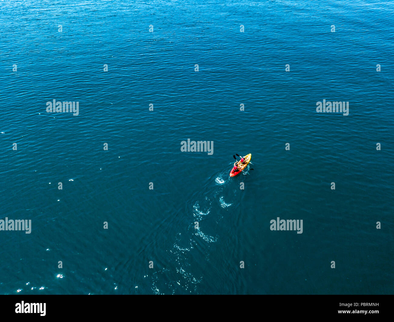 aerial kayak boat canoe on the water sea surface aerial Stock Photo - Alamy