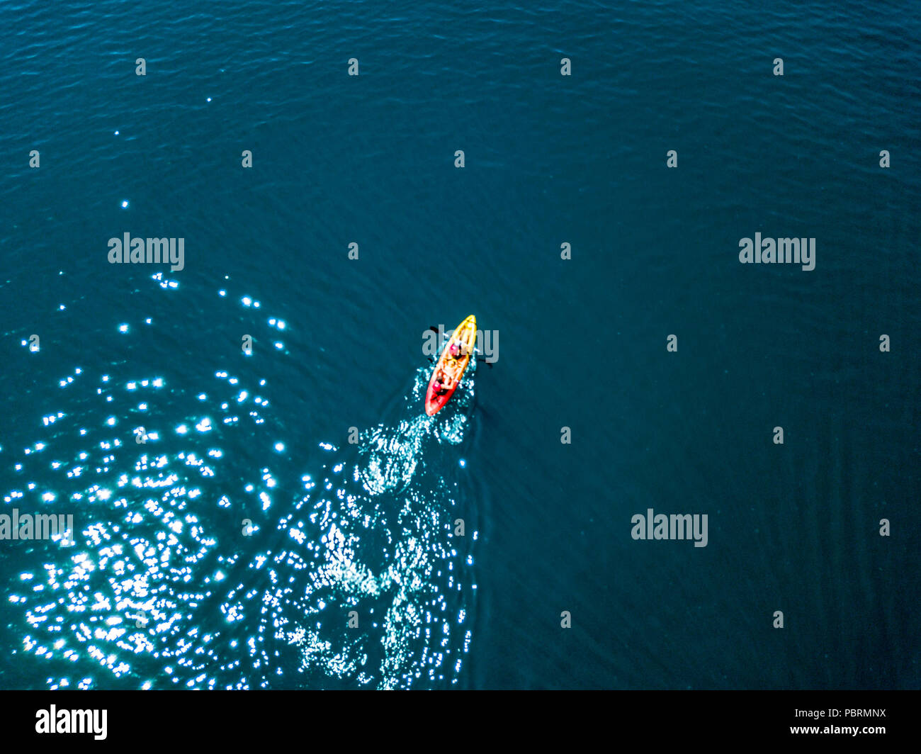 aerial kayak boat canoe on the water sea surface aerial Stock Photo - Alamy