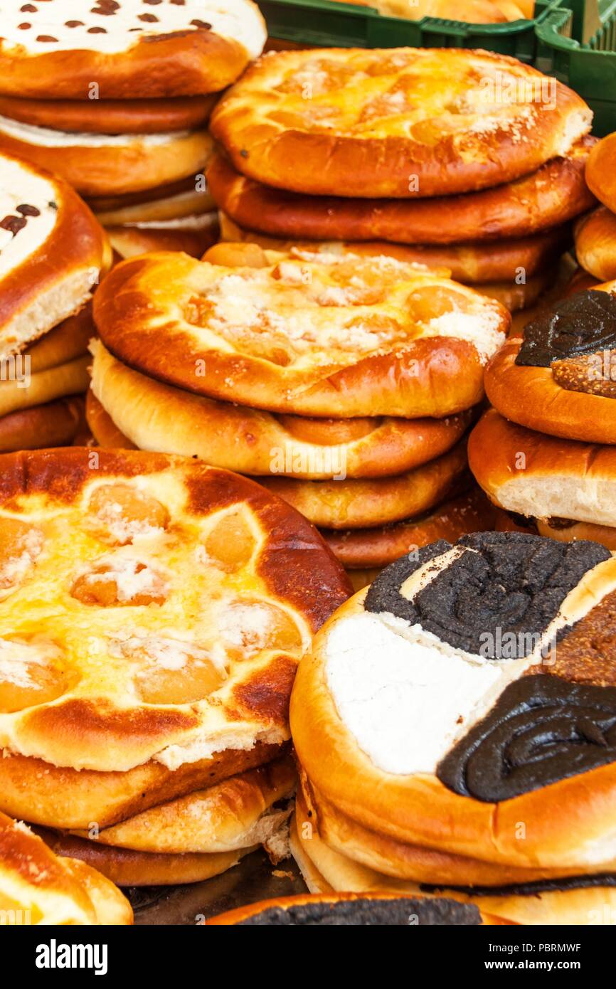 Fresh pastries for sale in a bakery. Sales of different types of cakes ...