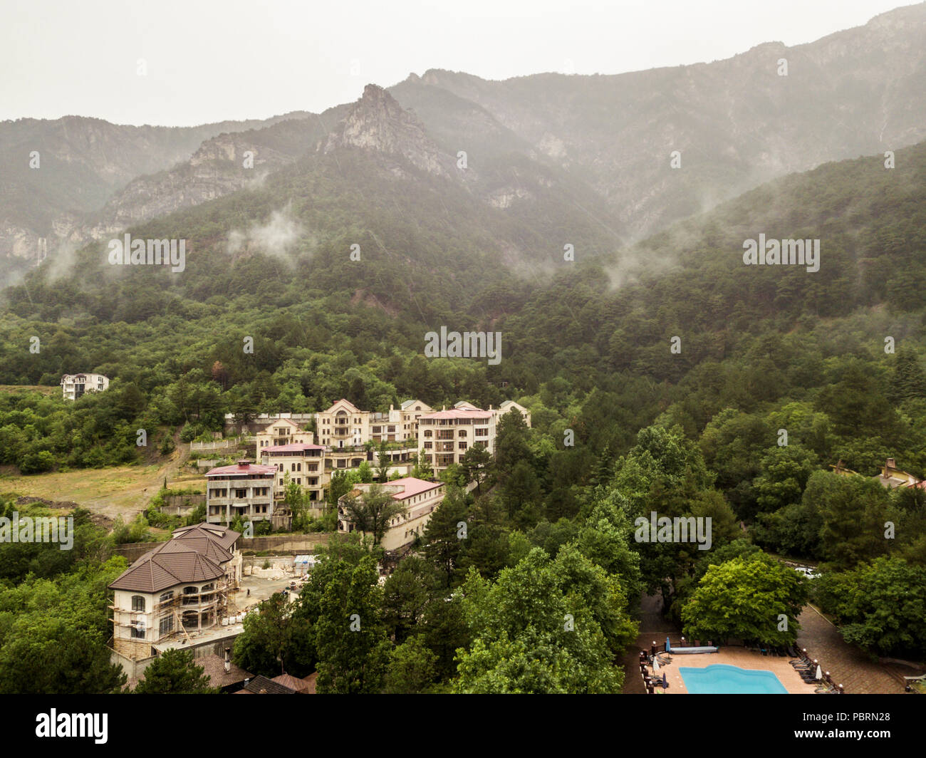 summer holidays resort hotel buildings in the mountains on a stormy ...