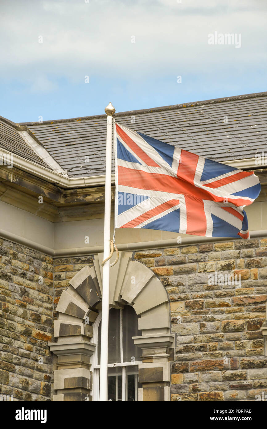 Union Jack flag flying outside the entrance to HM Prison Swansea Stock ...