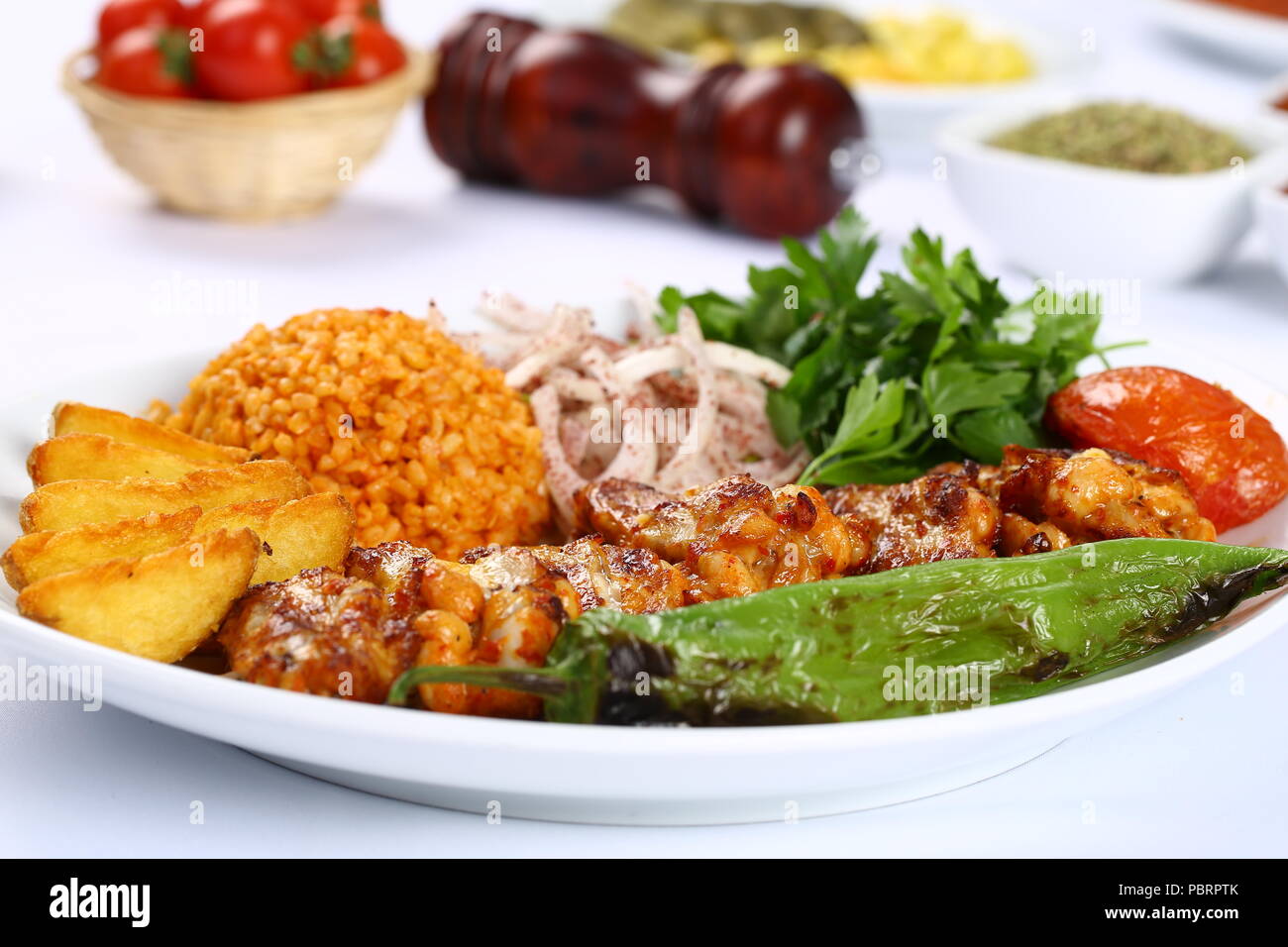 Grilled chicken kebab with rice and vegetables Stock Photo - Alamy