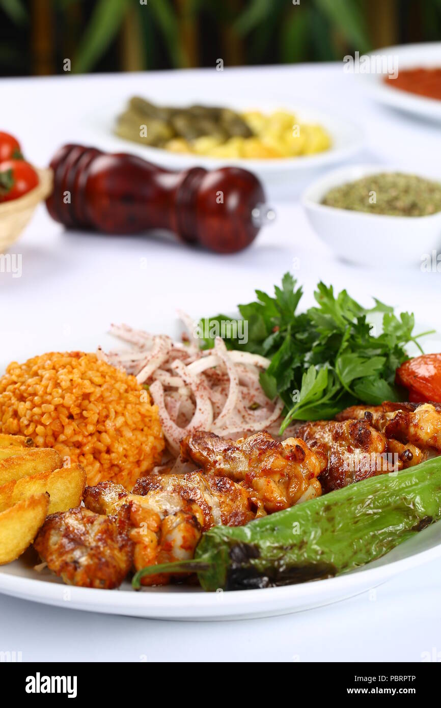 Grilled chicken kebab with rice and vegetables Stock Photo - Alamy