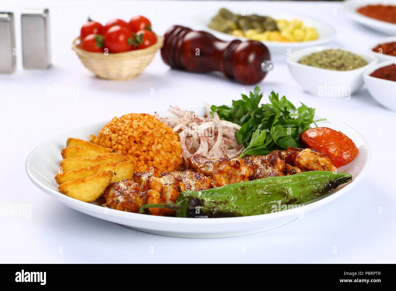 Grilled chicken kebab with rice and vegetables Stock Photo - Alamy