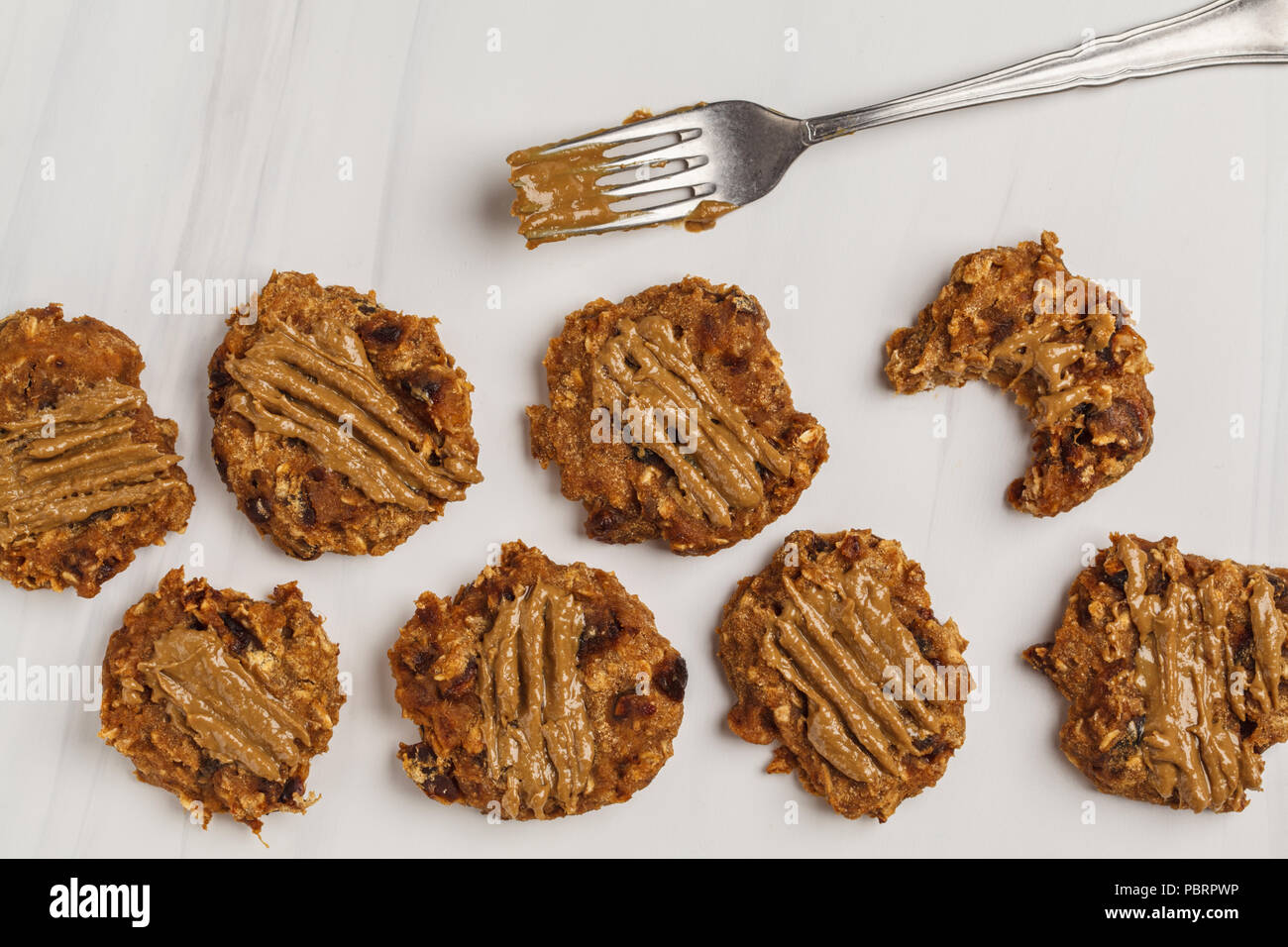 Vegan oatmeal cookies with peanut butter on white background, top view ...
