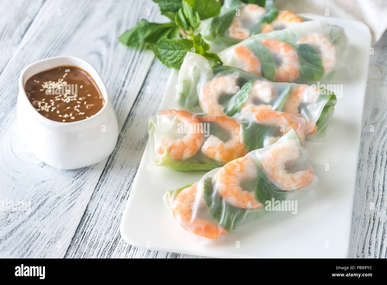 Shrimp rice paper rolls with peanut sauce Stock Photo - Alamy