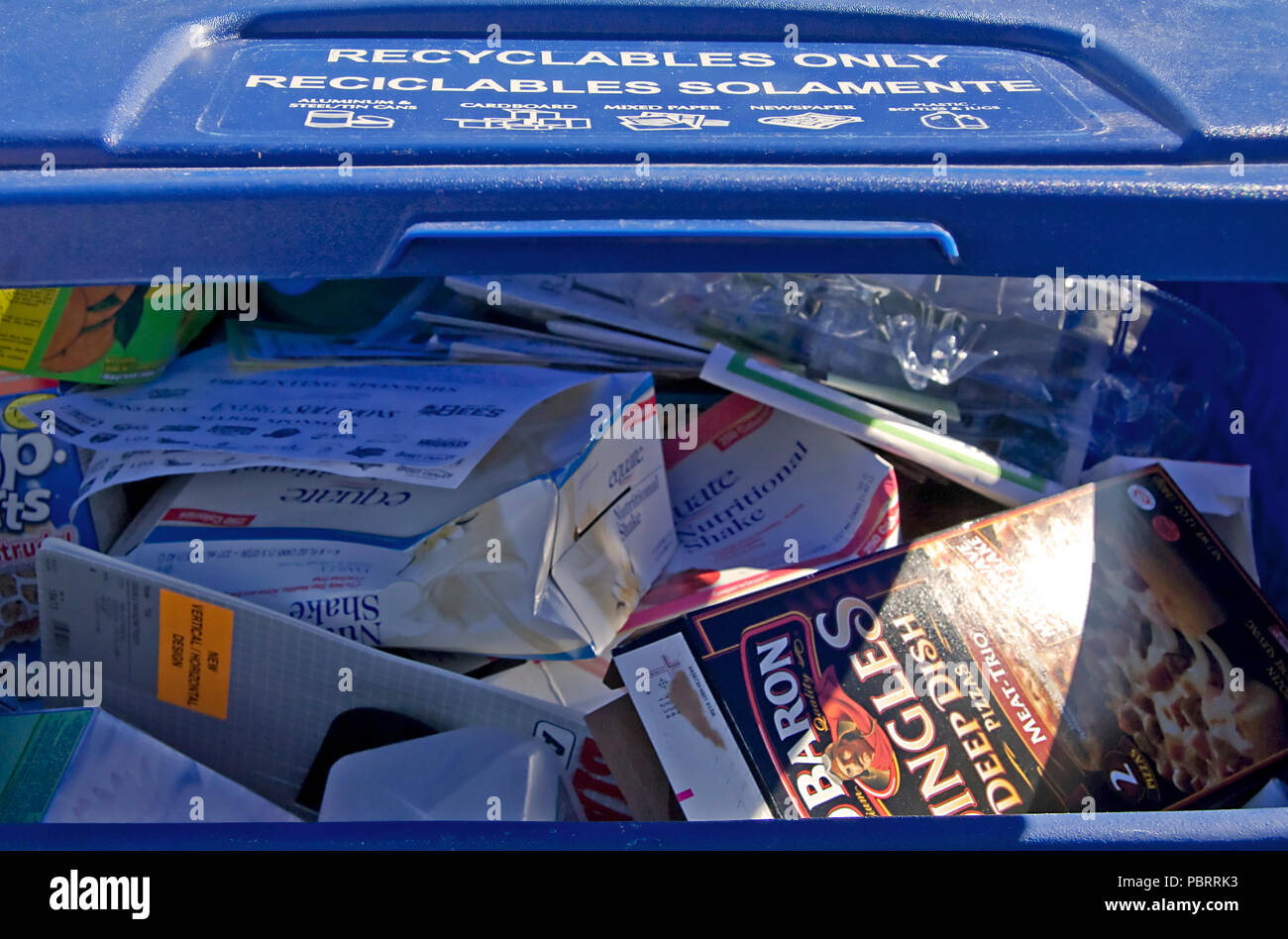 A large blue recylables container distributed by our city. Stamped on ...